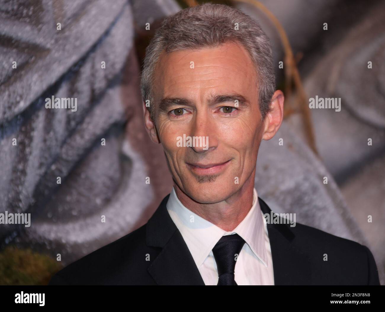 Actor Adam Brown poses for photographers upon arrival at the World ...