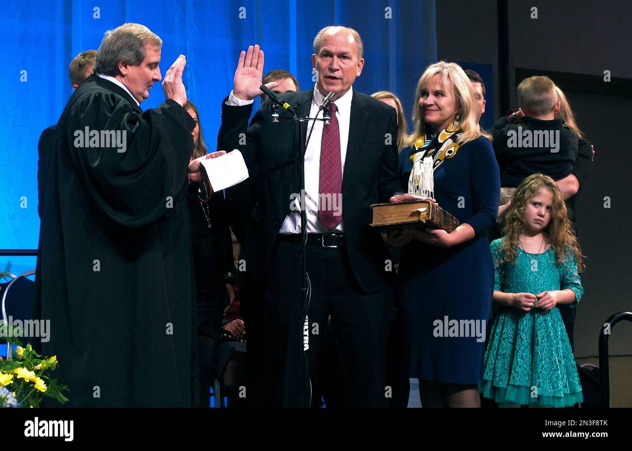 Bill Walker, center, is sworn in as Alaska's new governor as Alaska ...