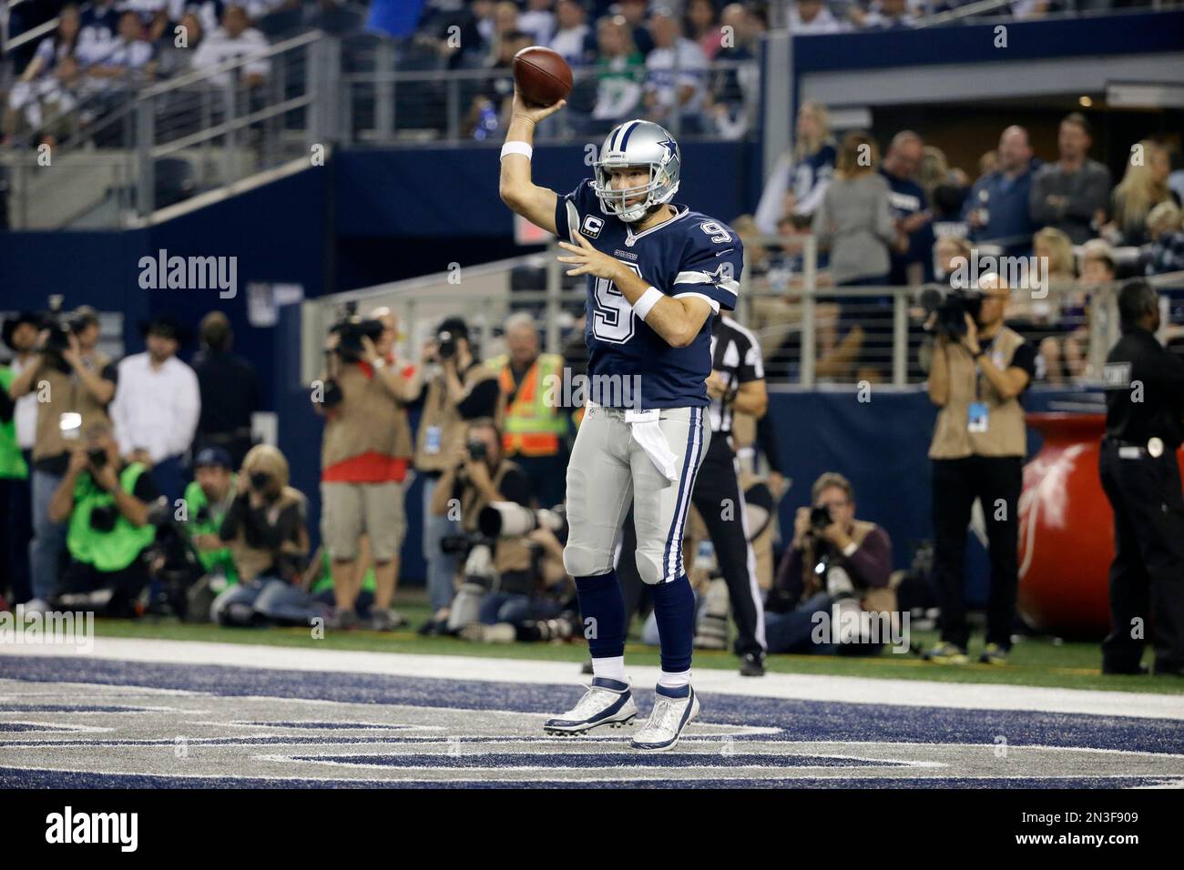 Dallas Cowboys quarterback Tony Romo (9) passes from the end zone ...
