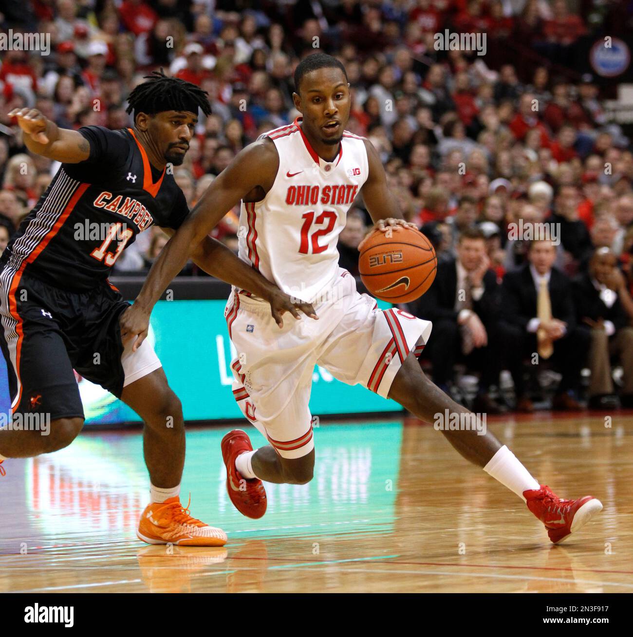 Ohio State's Sam Thompson, right, drives around Campbell's Quinton Ray ...