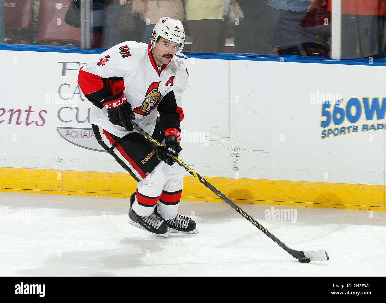 Ottawa Senators defenseman Chris Phillips (4) skates with the puck ...