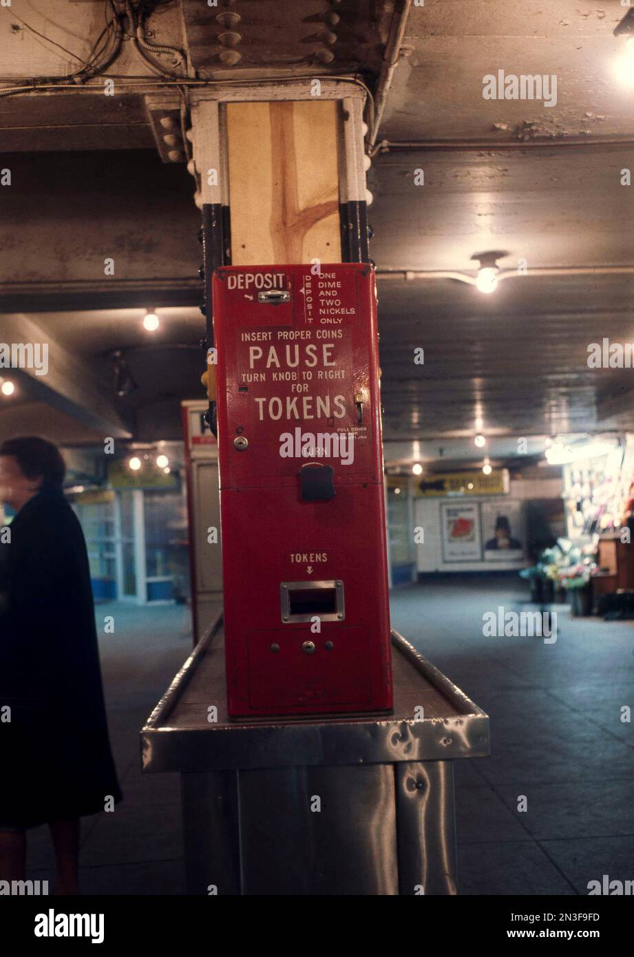 A mechanical token vending machine is pictured in a New York City ...