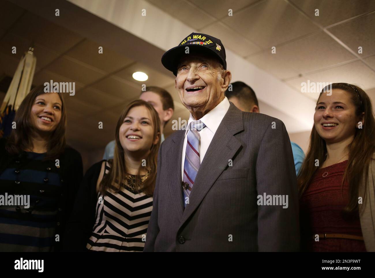 Leonard Stern, 88, center, poses for a picture with some of his ...