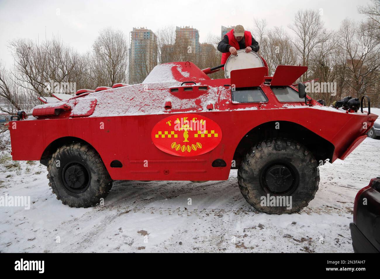 A driver looks into his Soviet era APC converted into a four seat ...