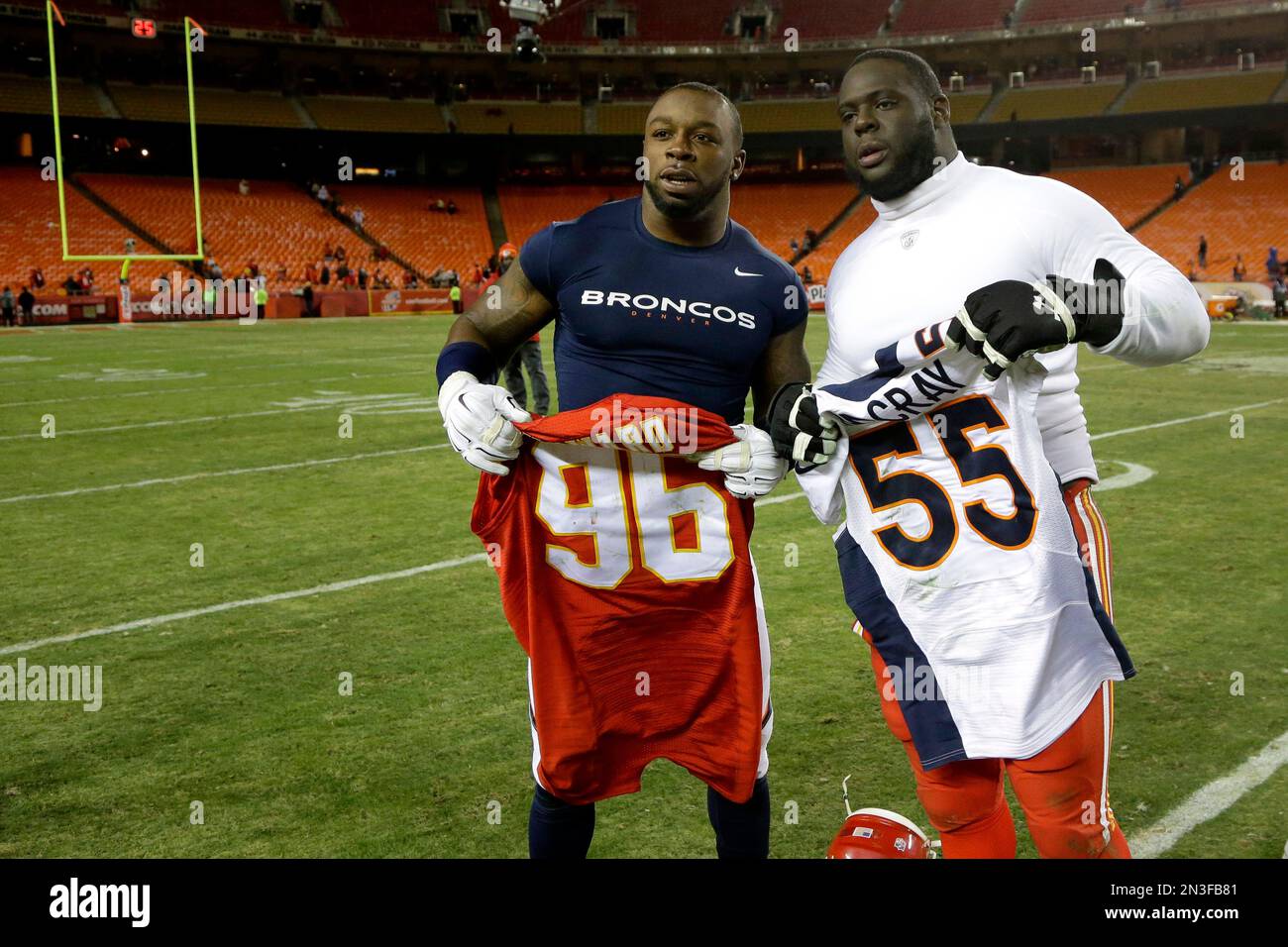 Kansas City Chiefs defensive end Jaye Howard, right, and Denver Broncos ...