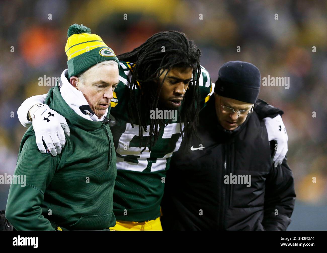 Green Bay Packers' Jamari Lattimore is helped off the field during the ...