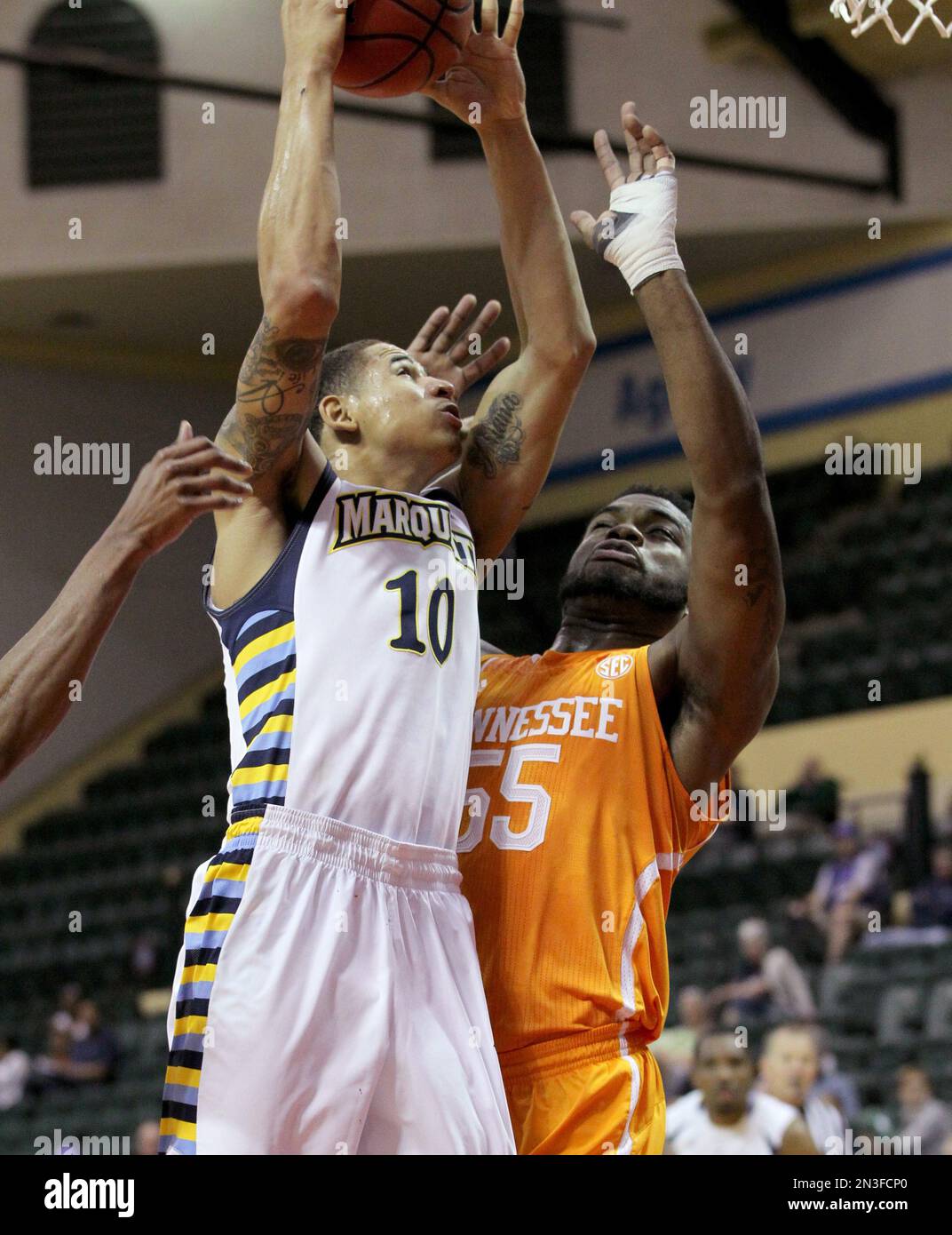 Marquette forward Juan Anderson (10) shoots over Tennessee forward ...