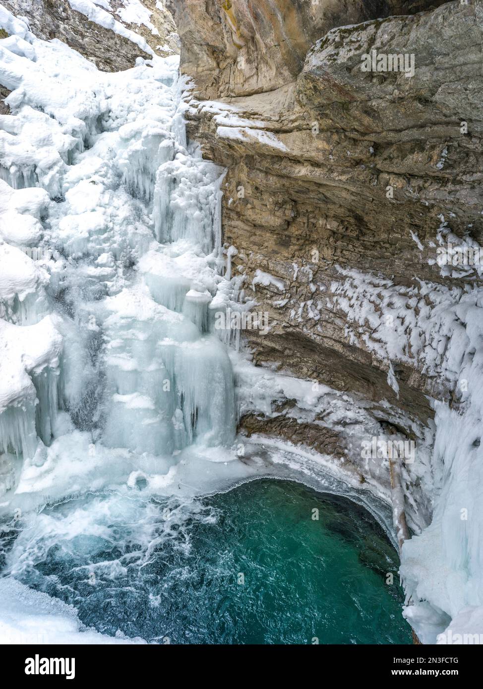Winter beauty in Johnston Canyon, ice formations along a rock wall and ...