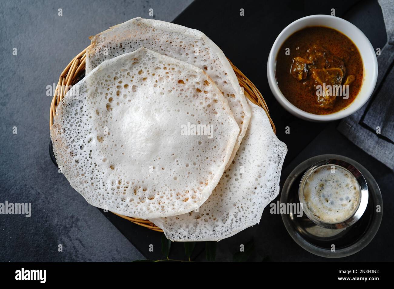 Kerala breakfast appam or palappam with mutton curry Stock Photo - Alamy