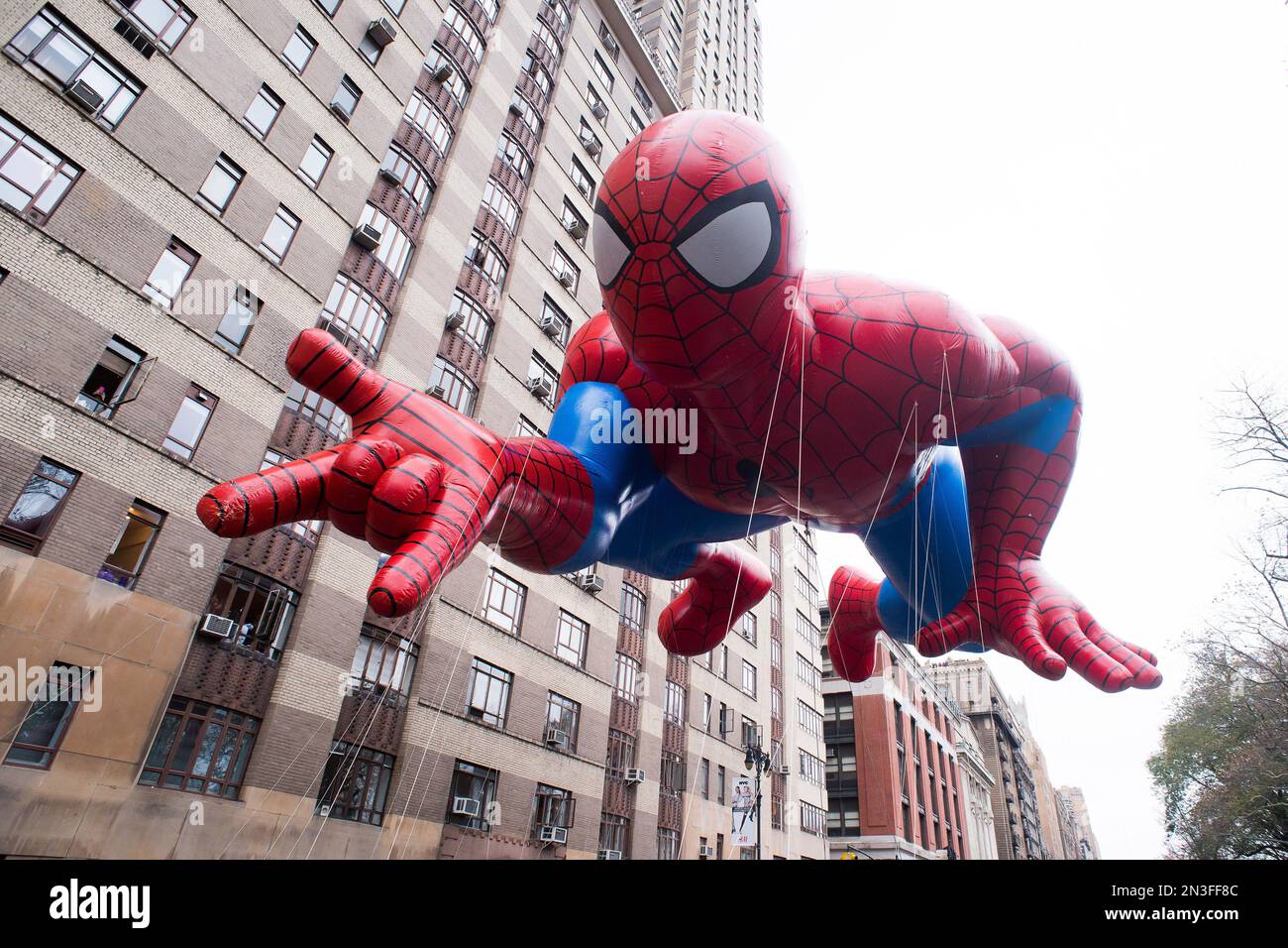 The Spider-Man balloon floats in the Macy's Thanksgiving Day Parade on ...