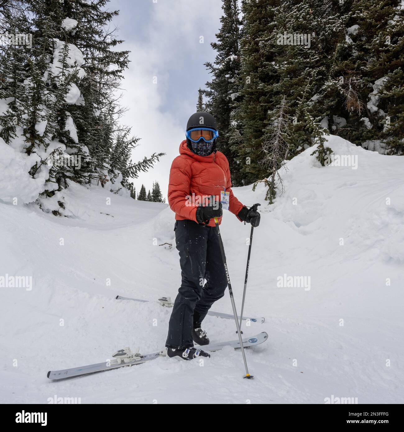 Female skier at a ski resort in the Rocky Mountains of Banff National ...