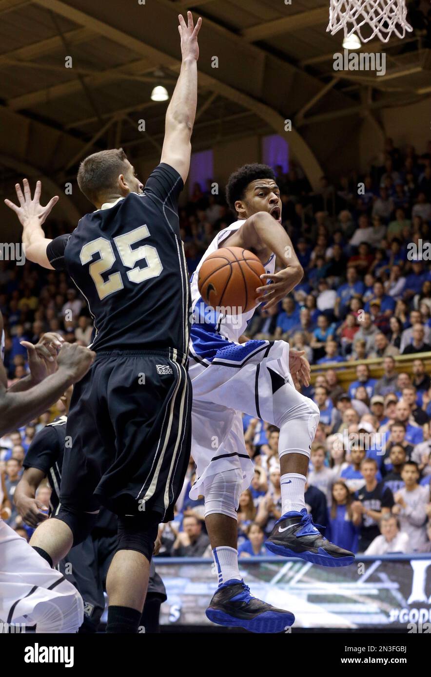 Duke's Quinn Cook passes around Army's Luke Morrison (25) during the ...