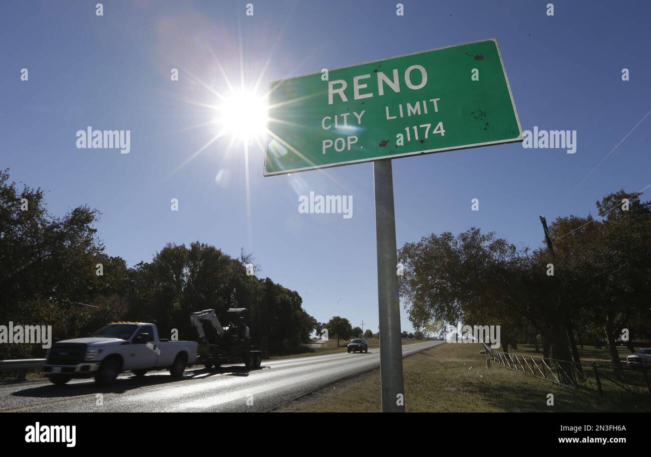 In this Wednesday, Nov. 19, 2014 photo, vehicles drive past the city ...