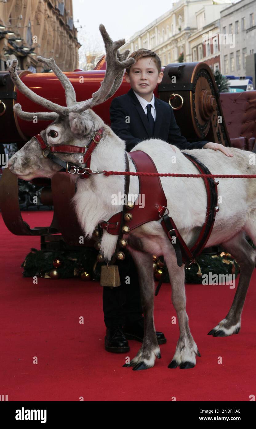 Actor Kit Connor poses with a reindeer for photographers on arrival at ...