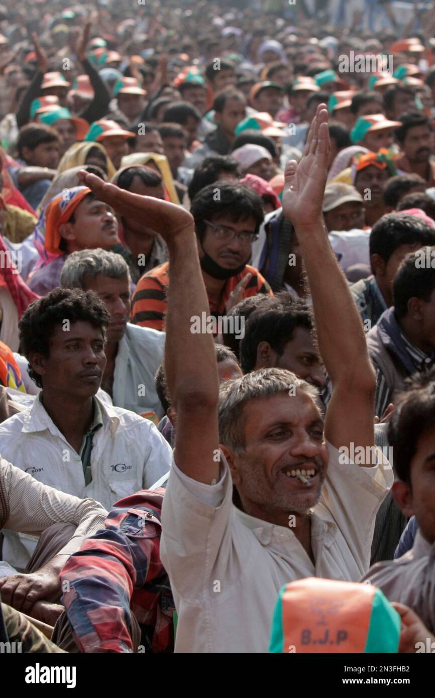 A supporter of India's ruling Bharatiya Janata Party (BJP) cheers as he ...