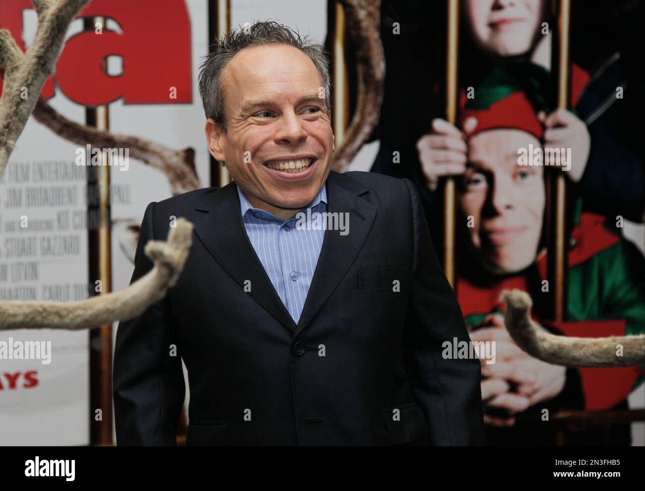 Actor Warwick Davis poses for photographers on arrival at the premier ...