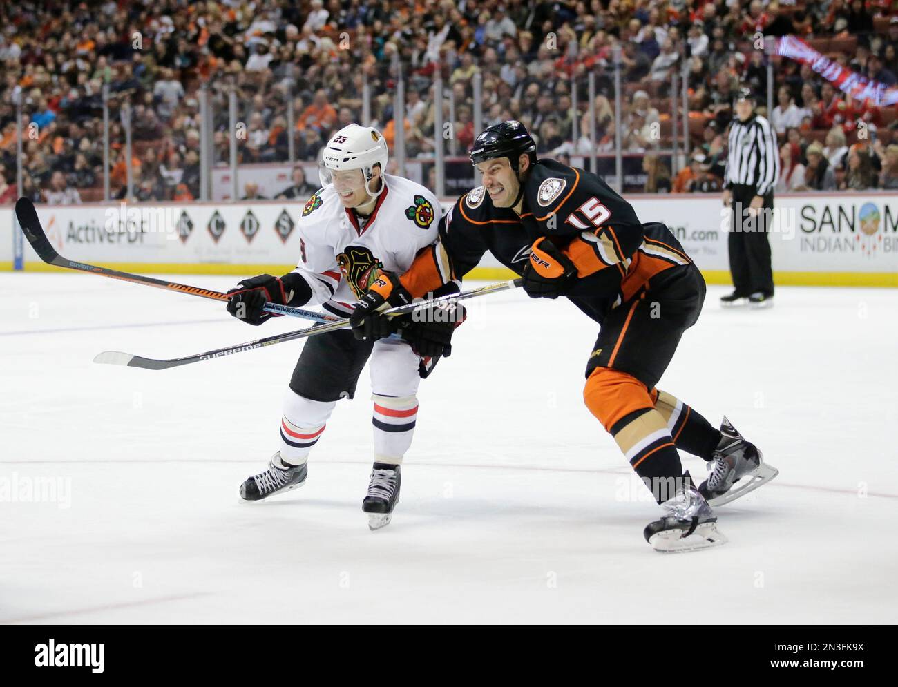 Anaheim Ducks' Ryan Getzlaf, right, pushes Chicago Blackhawks' Kris ...