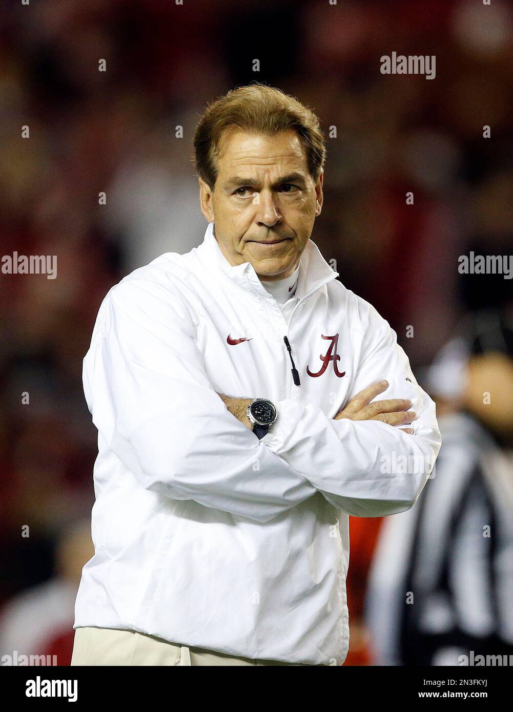 Alabama head coach Nick Saban watches his team warm up before the first ...