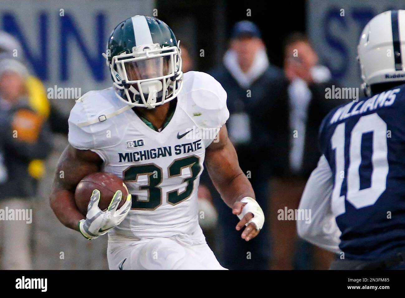 Michigan State running back Jeremy Langford (33) carries the ball for a ...