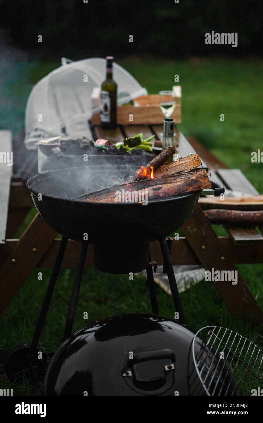 The smoking brazier of a round form. Firewood flares up in the brazier ...