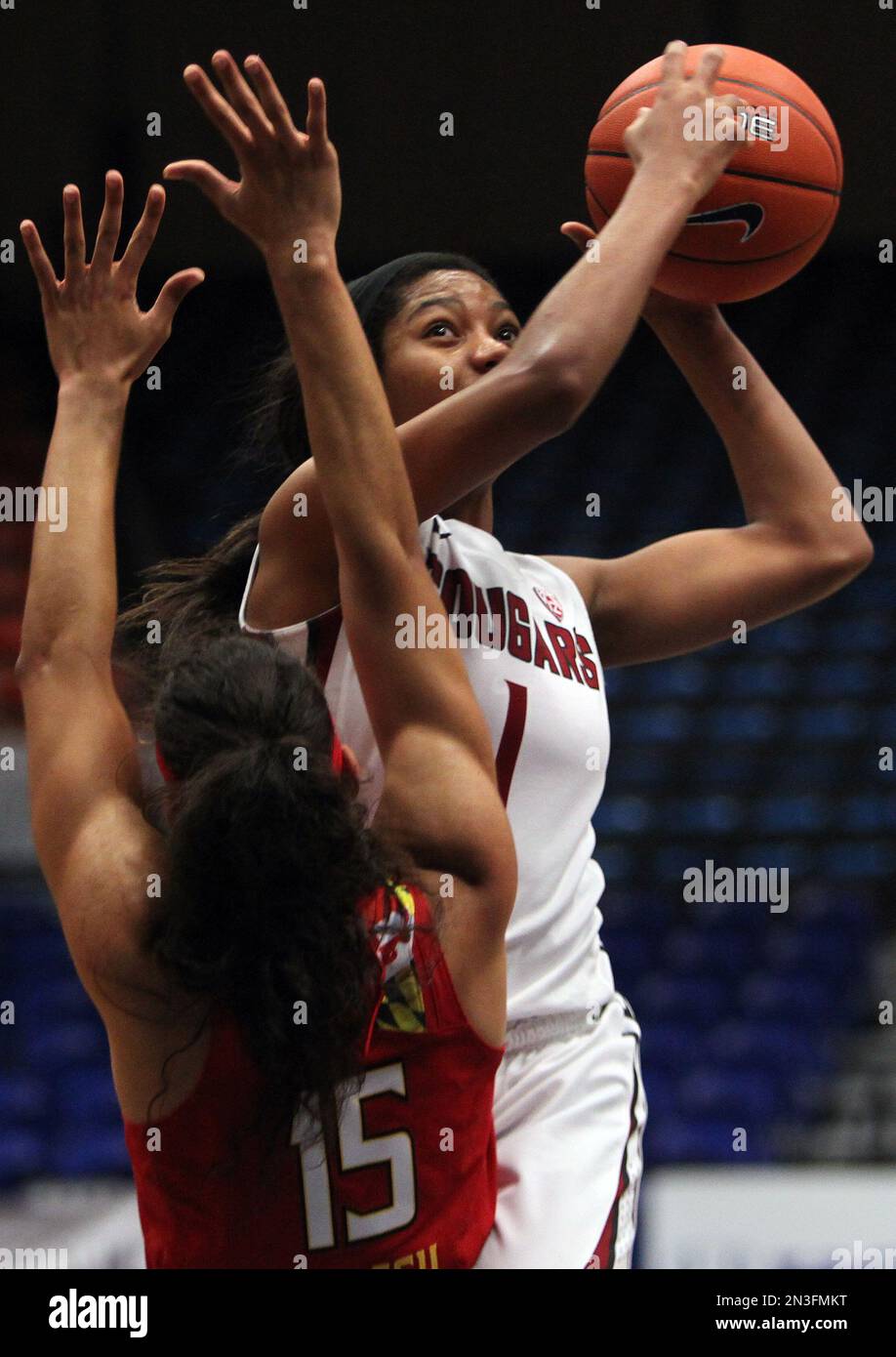 Washington State guard Caila Haliey, right, goes up for a shot against ...