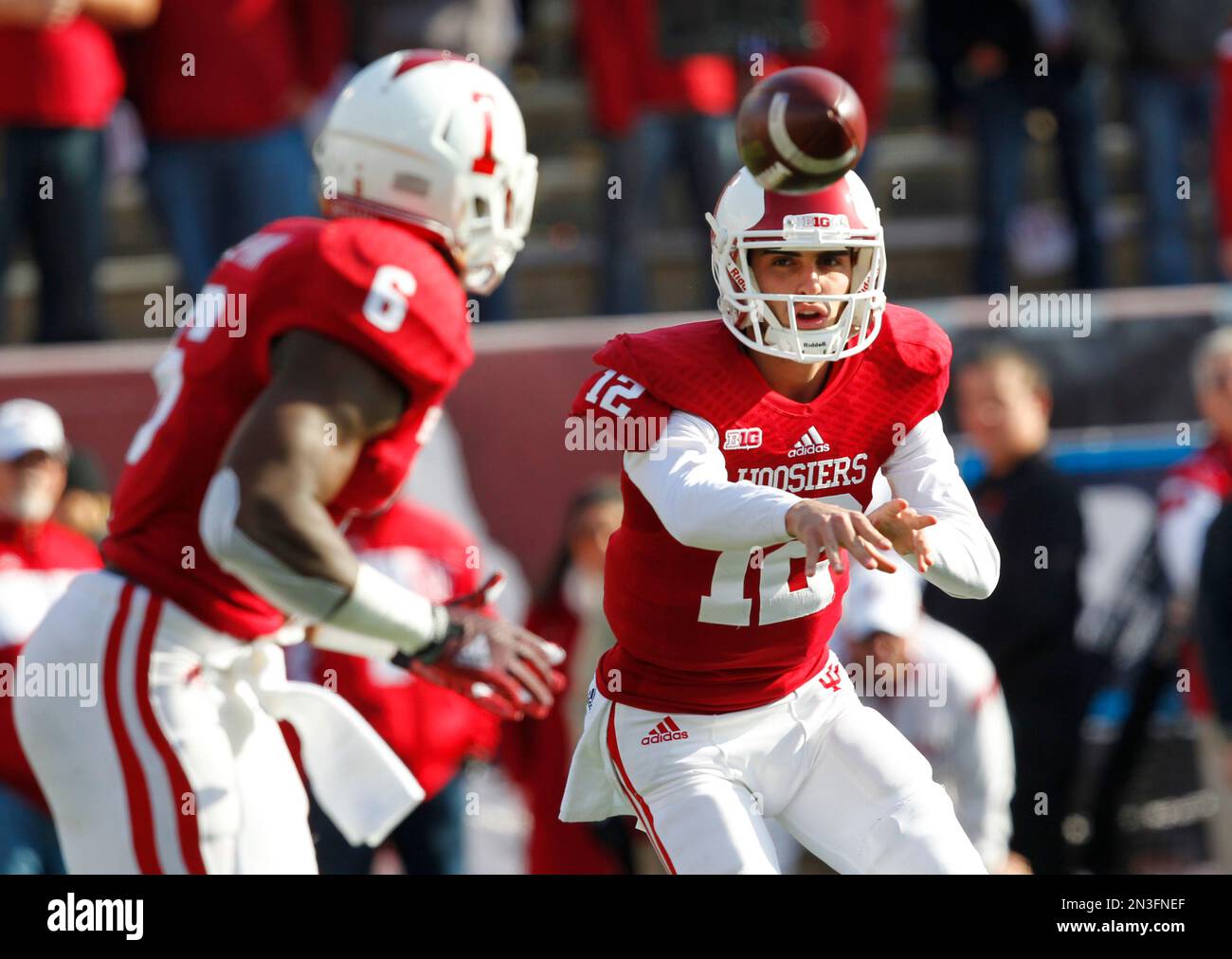 Indiana quarterback Zander Diamont (12) pitches the football to Tevin ...