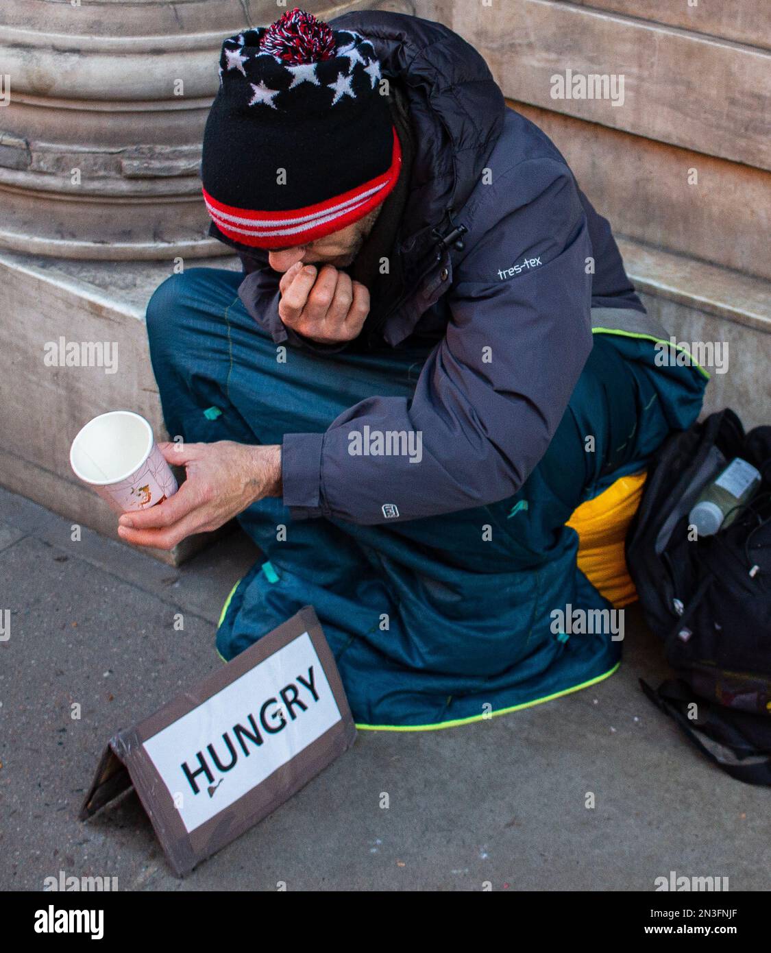 Beggar holding cup for money hi-res stock photography and images - Alamy