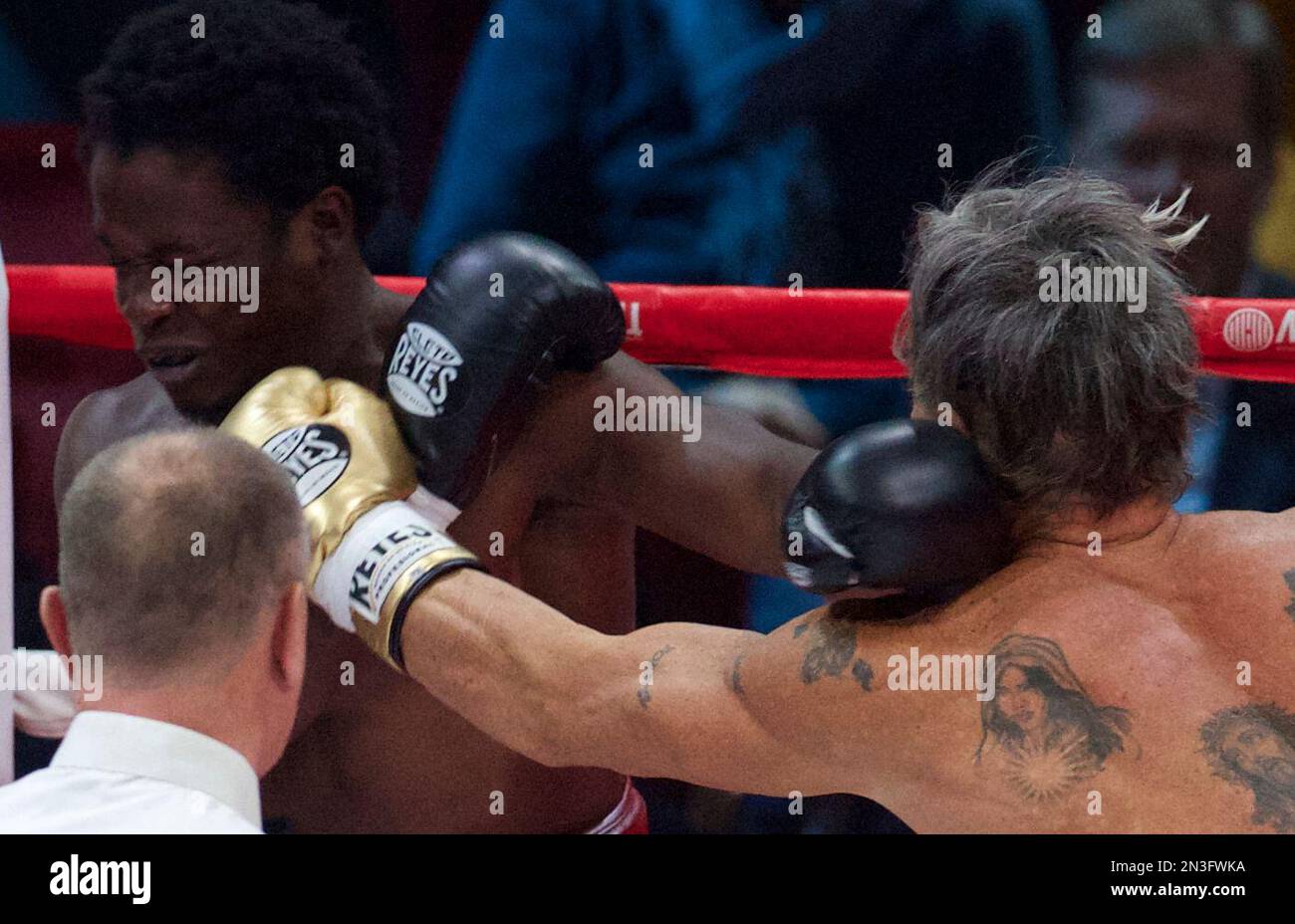 US actor Mickey Rourke, right, punches his opponent Elliot Seymour of ...