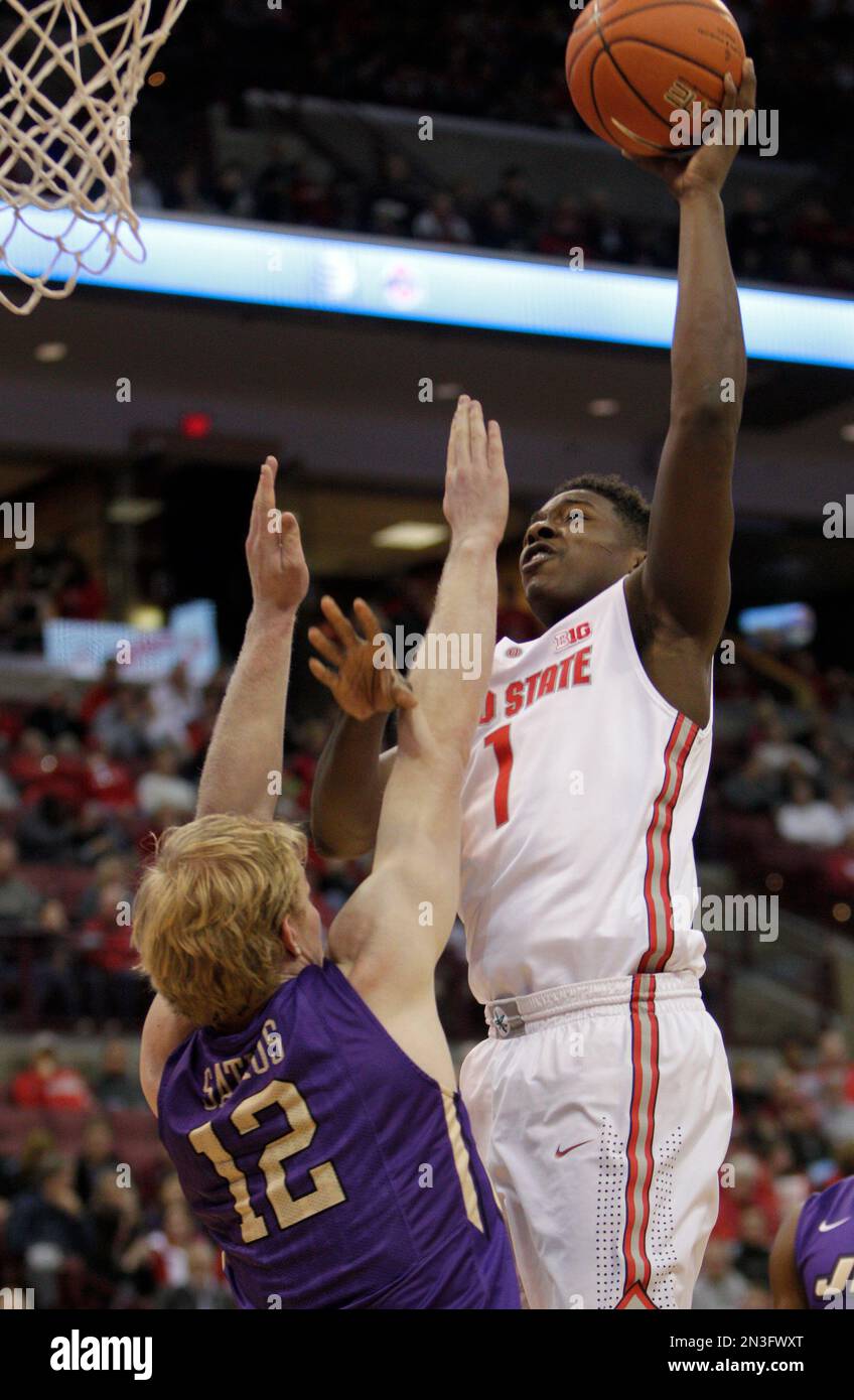 Ohio State's Jai'Sean Tate, right, shoots over James Madison's Paulius ...