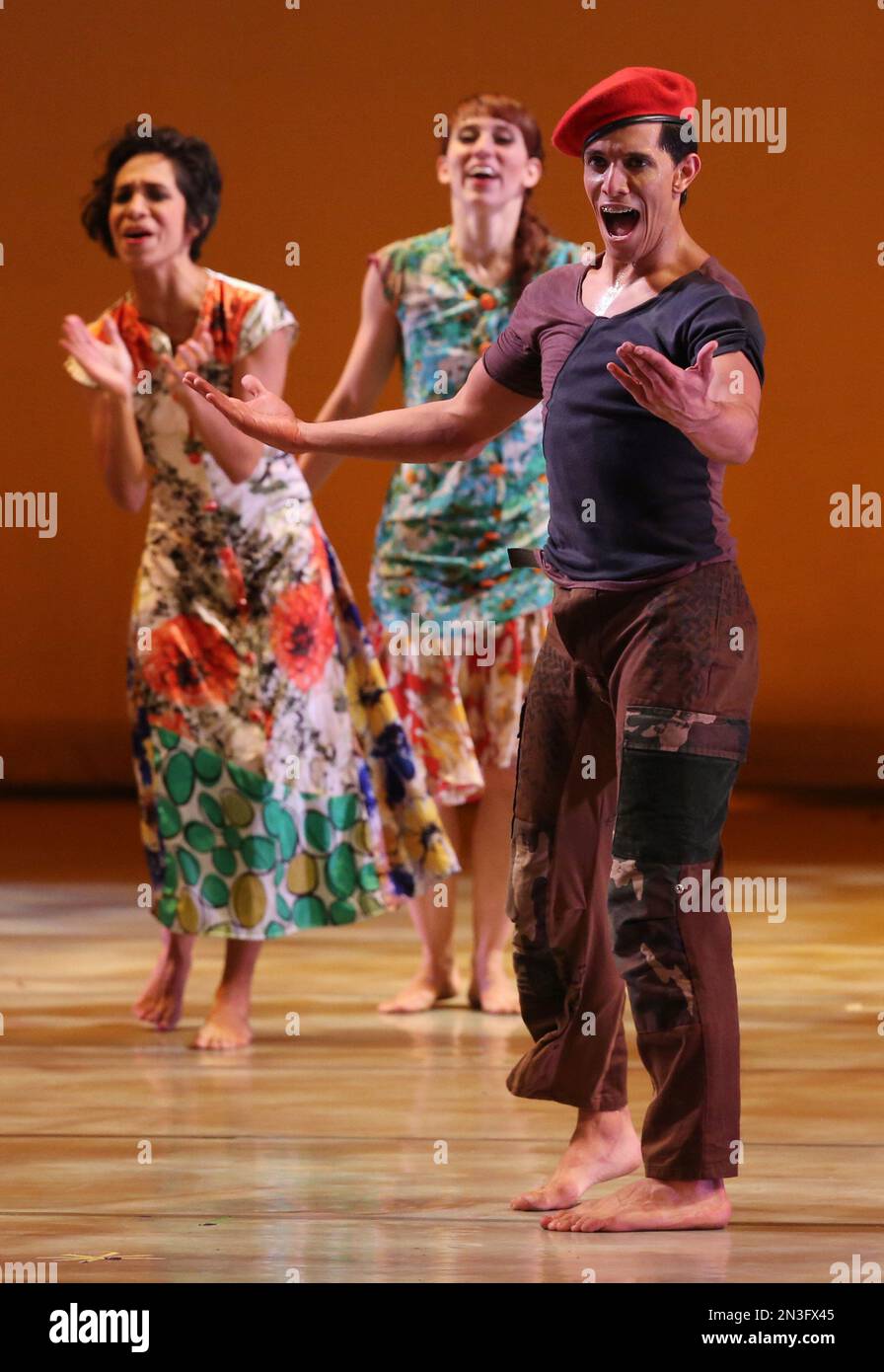 John Lobo, 29, wearing a red beret performing as Venezuela's late ...