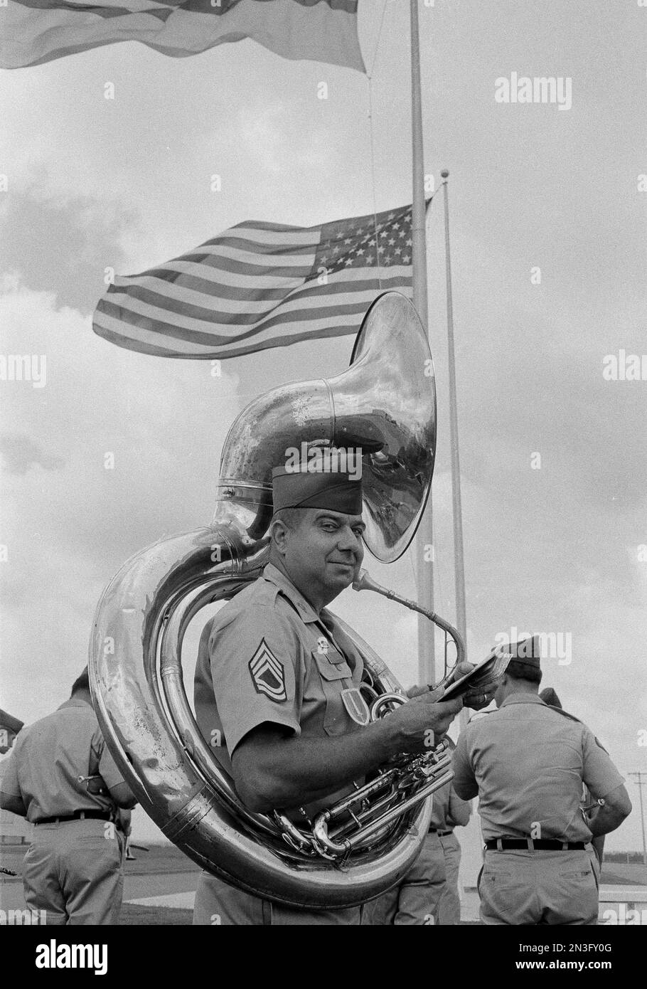 A U.S. Army tuba player rests after playing for a Fourth of July ...
