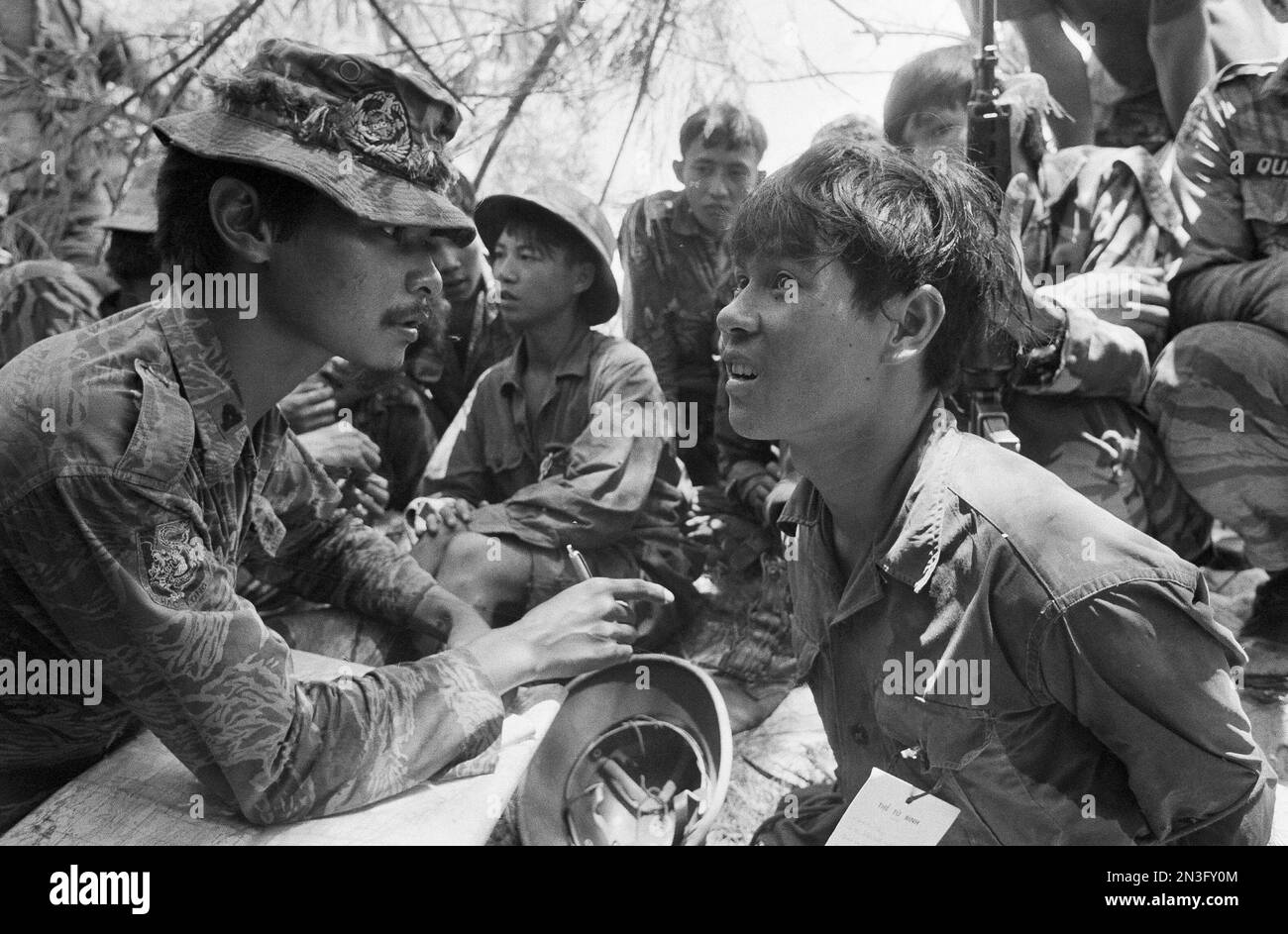 Youthful North Vietnamese prisoner, right, is questioned by South ...
