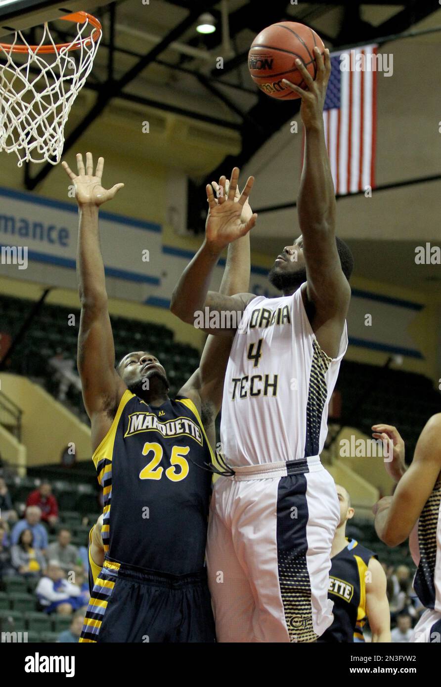 Georgia Tech center Demarco Cox (4) shoots over Marquette forward Steve ...