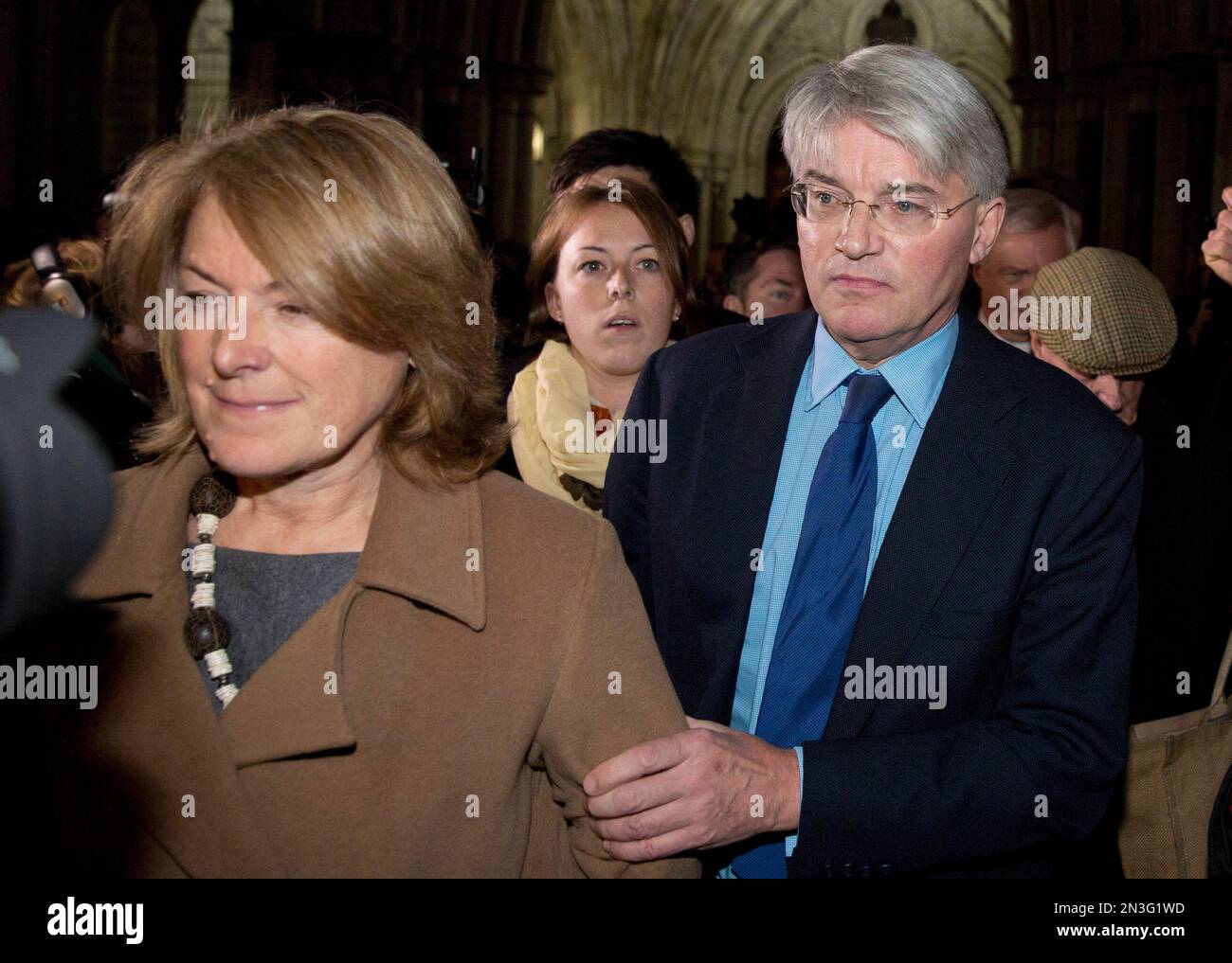 Andrew Mitchell, right, Britain's former government chief whip, and his ...
