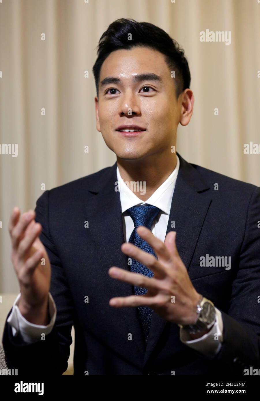 Taiwanese actor Eddie Peng answers questions during an interview for ...