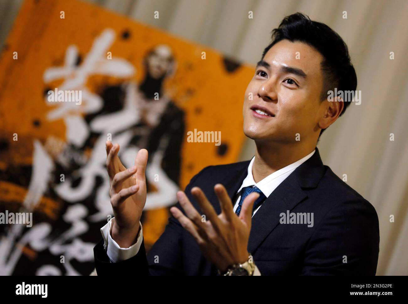 Taiwanese actor Eddie Peng answers questions during an interview for ...