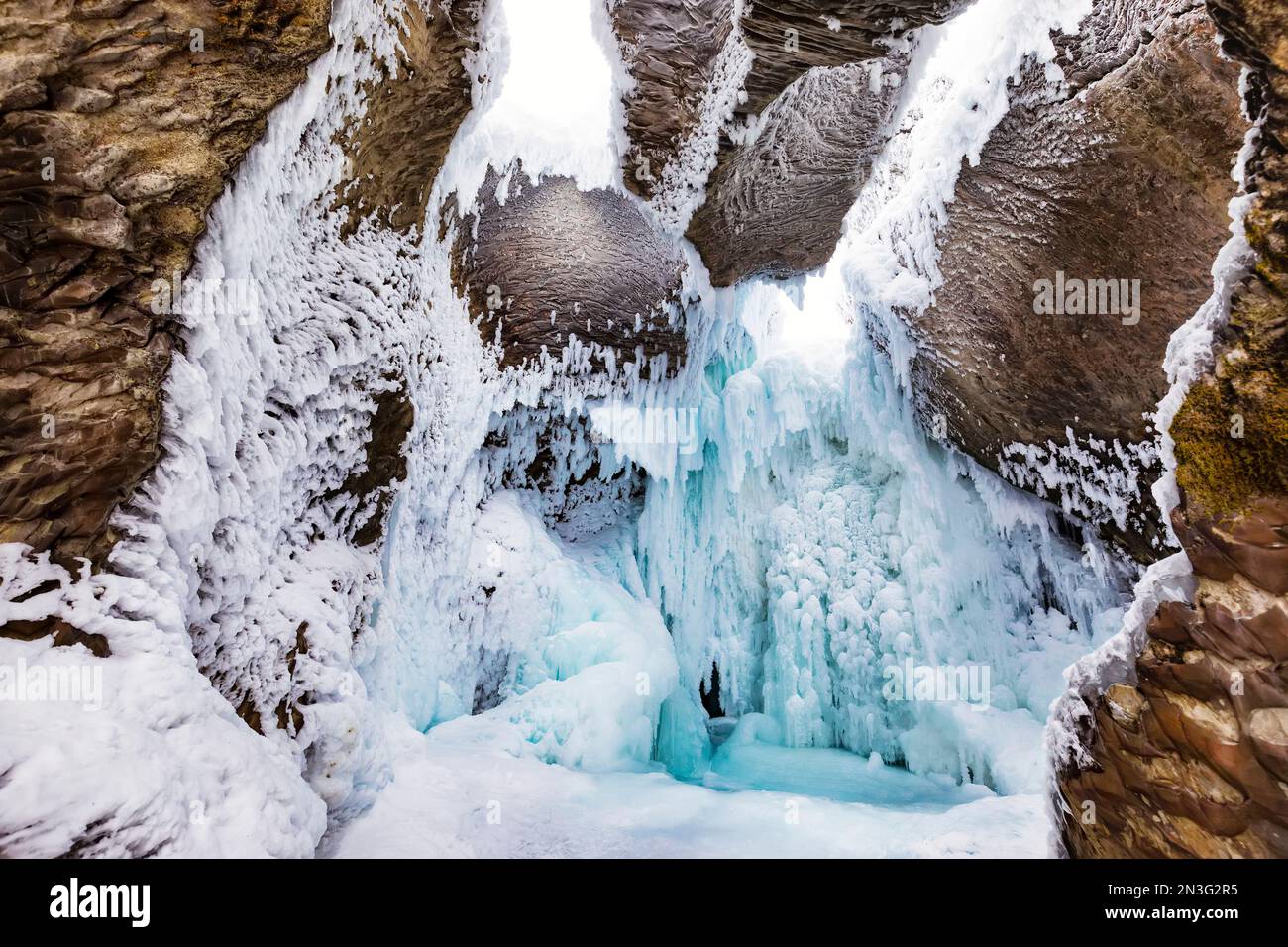 Frozen waterfall and pool at Johnston Canyon during winter in Banff ...