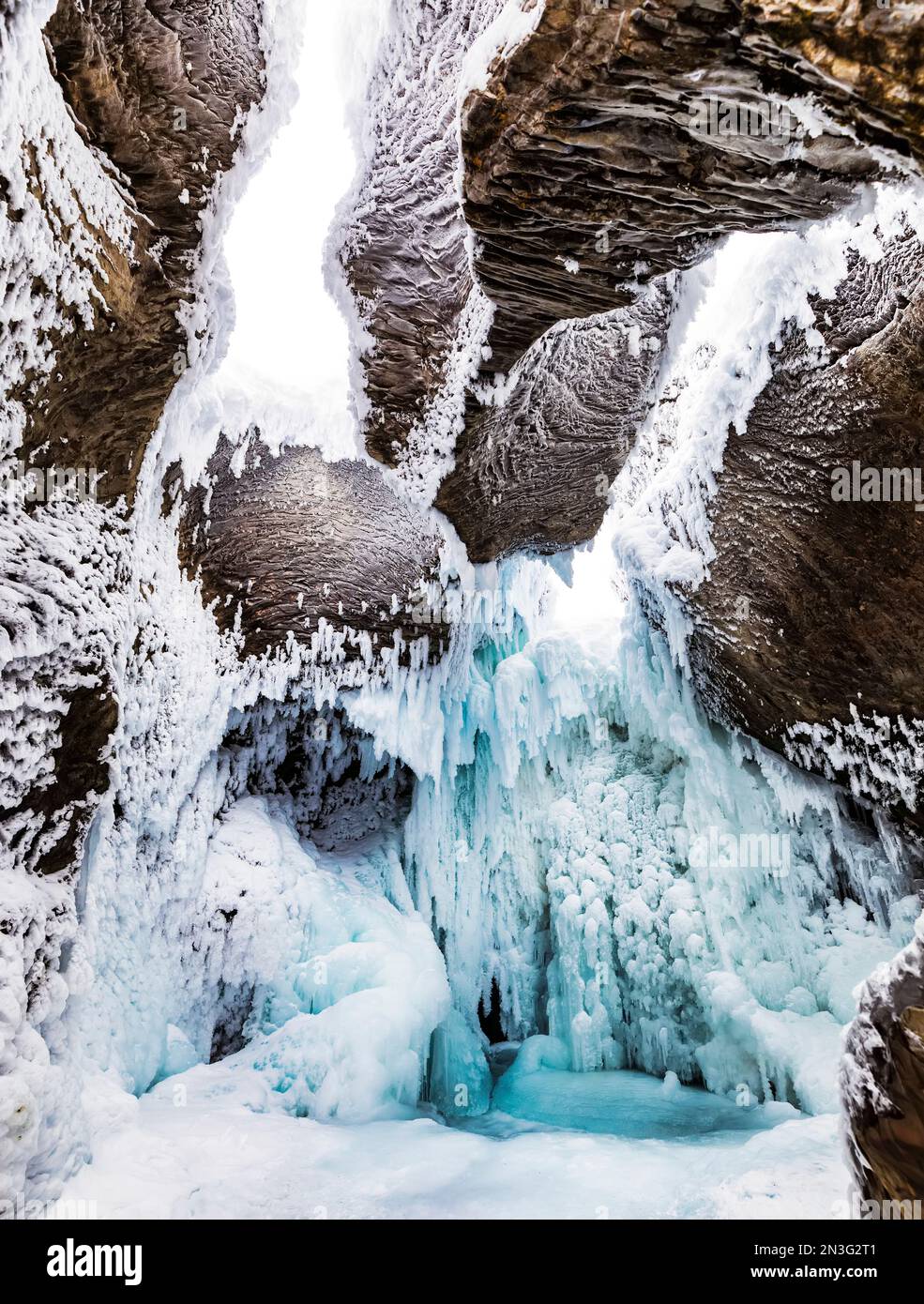 Frozen waterfall and pool at Johnston Canyon during winter in Banff ...