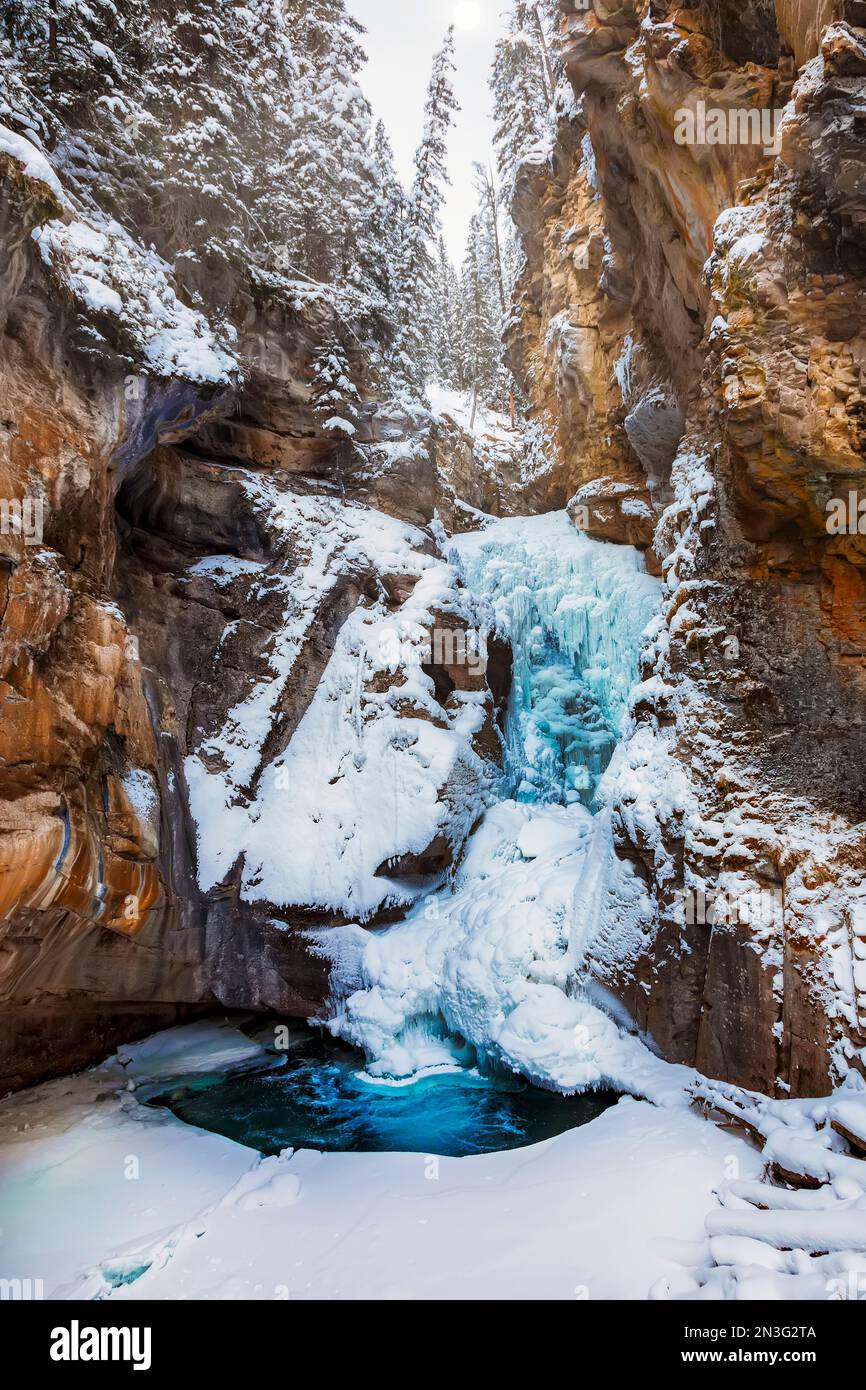 Frozen waterfall and pool at Johnston Canyon during winter in Banff ...