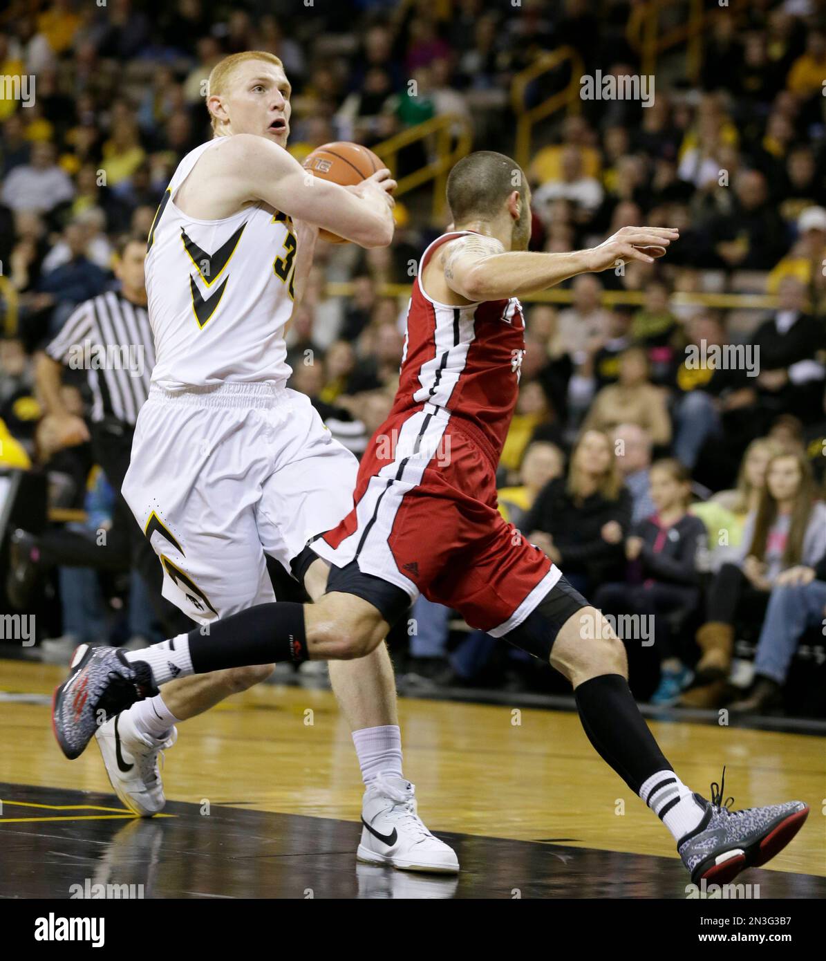 Iowa forward Aaron White, left, drives to the basket past Northern ...