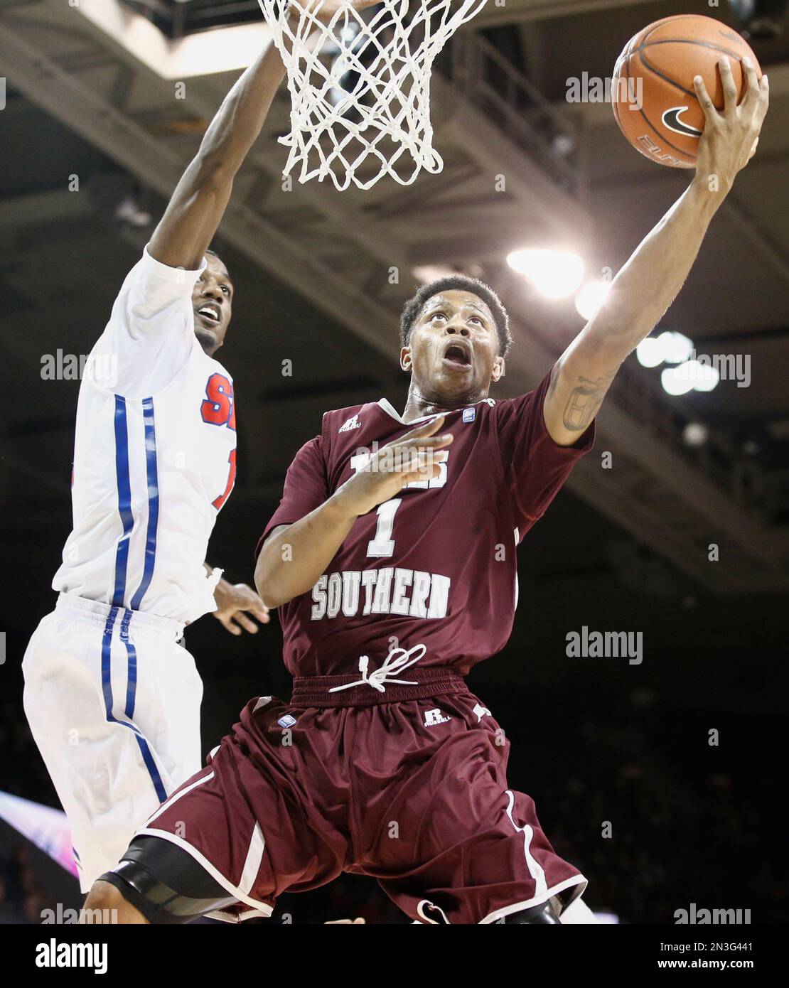 Texas Southern guard Deverell Biggs (1) shoots the ball past Southern ...