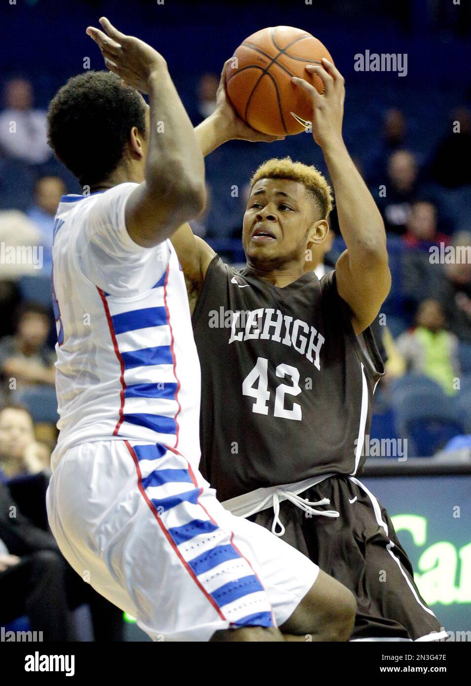 Lehigh guard Brandon Alston (42) looks to pass against DePaul forward ...