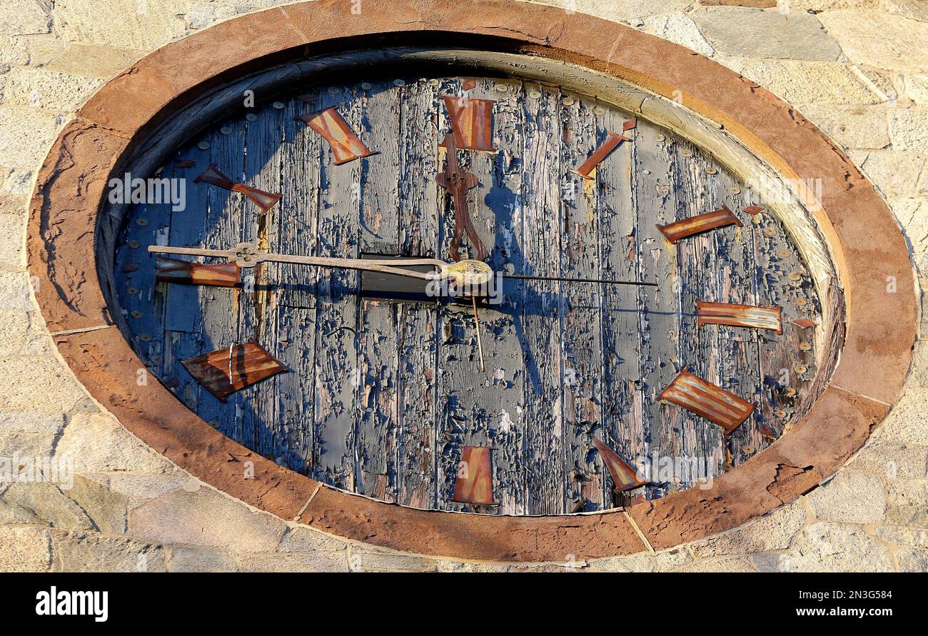 In this Wednesday, Nov. 19, 2014 photo, a clock with flaking paint ...