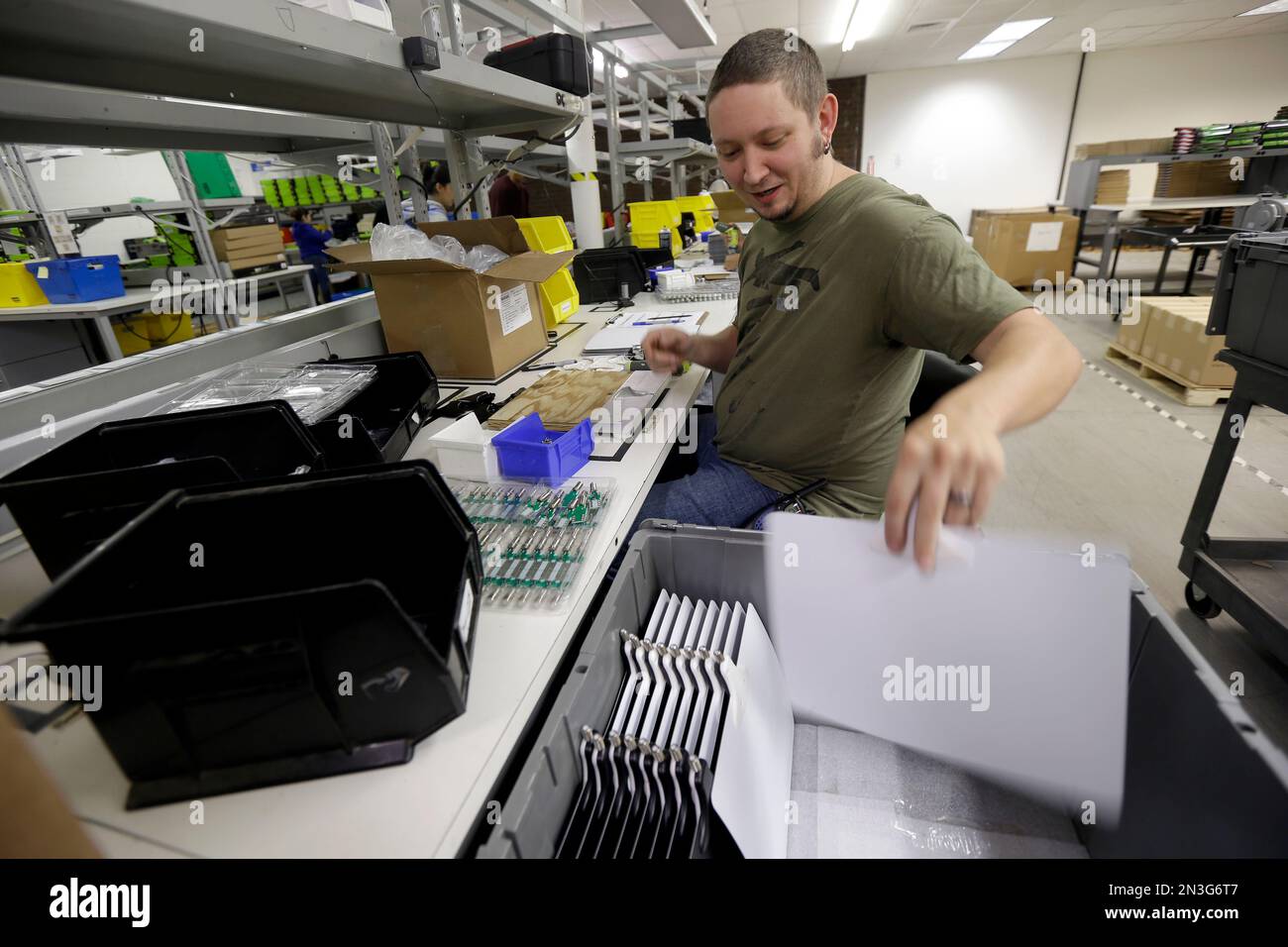 In this photo taken Friday, Nov. 21, 2014, employee Joel Elder ...