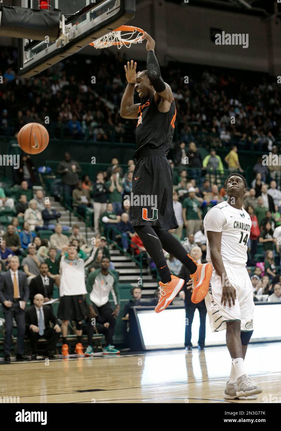 Miami's Sheldon McClellan (10) goes up to dunk over Charlotte's ...