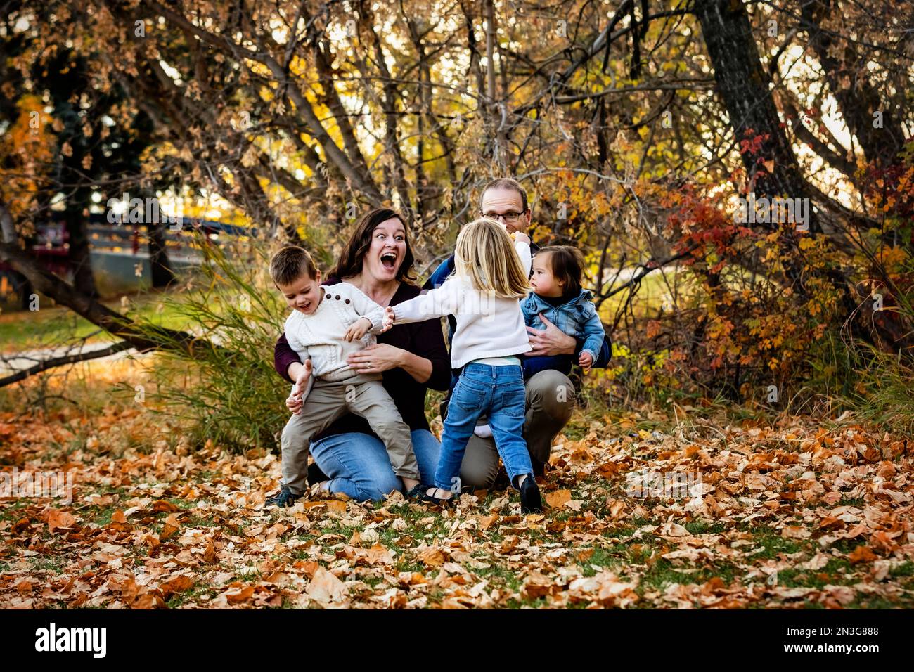 Young family with three children, youngest daughter with Down Syndrome ...