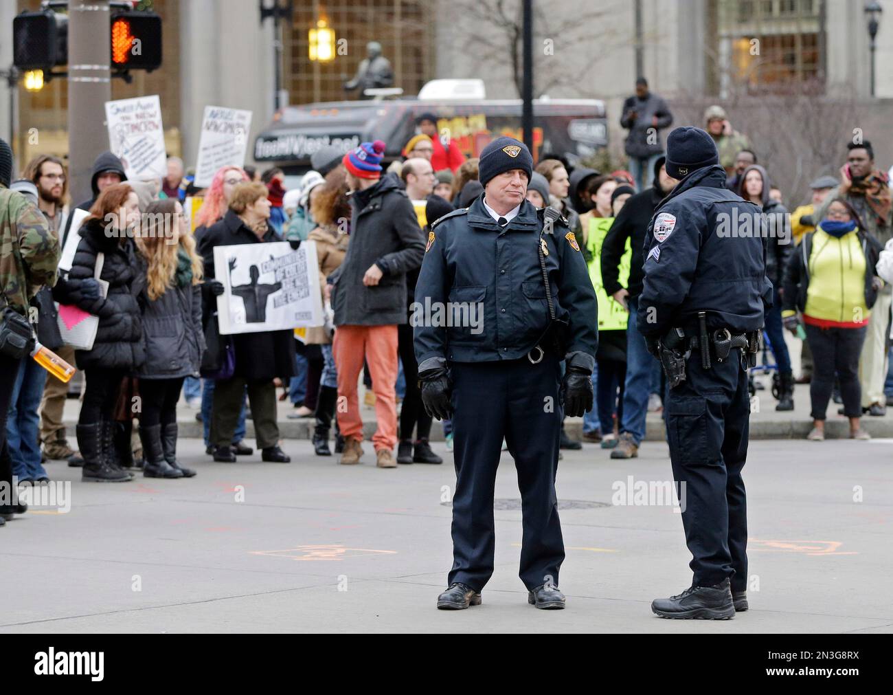 Police officers monitor demonstrators blocking Public Square in ...