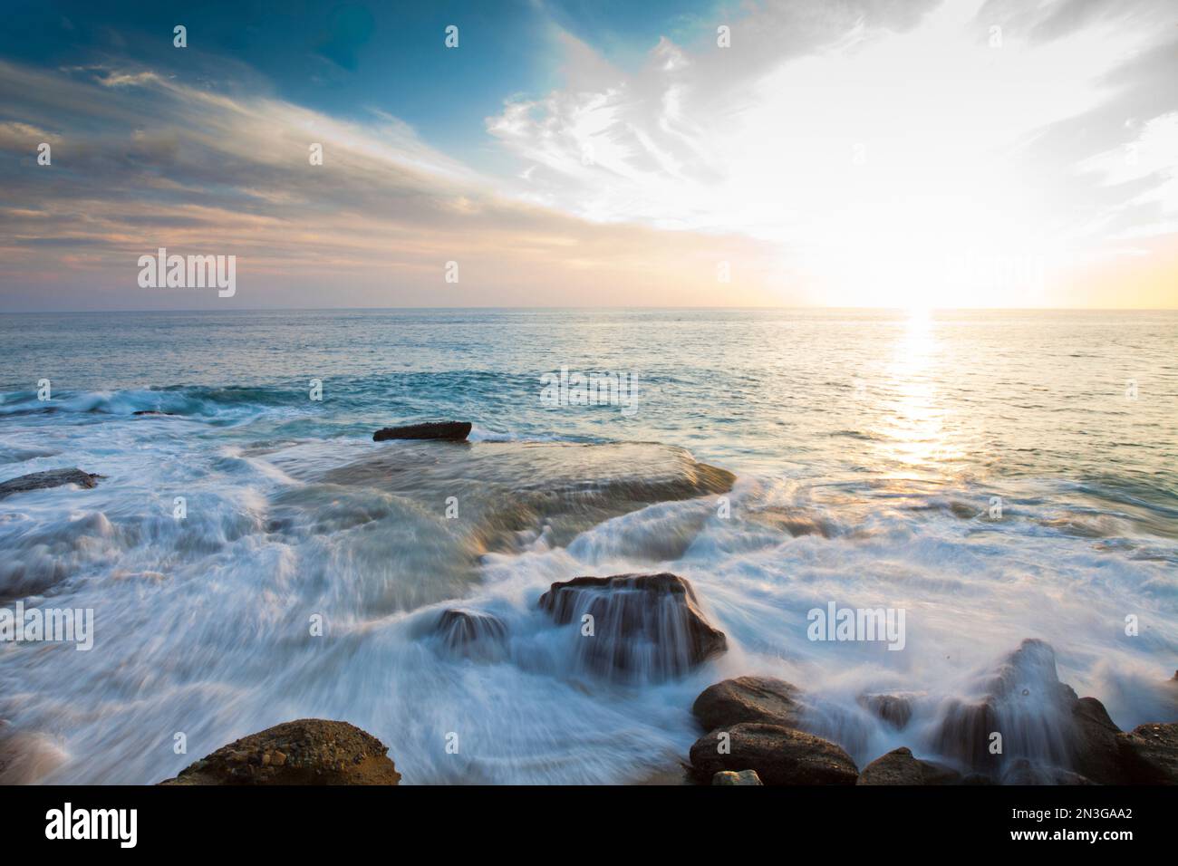 Waves break sea sunset hi-res stock photography and images - Alamy