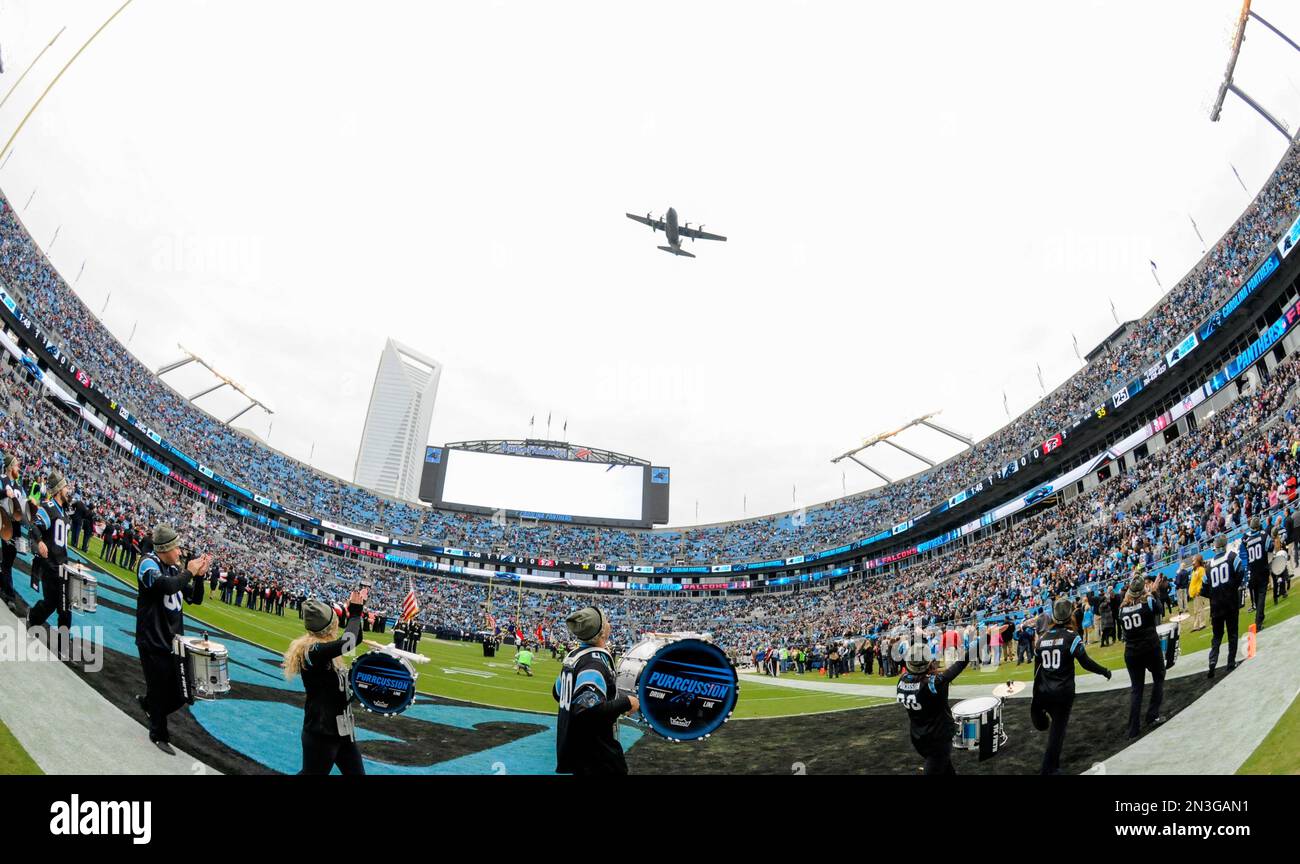 A military aircraft performs a flyby before an NFL football game ...