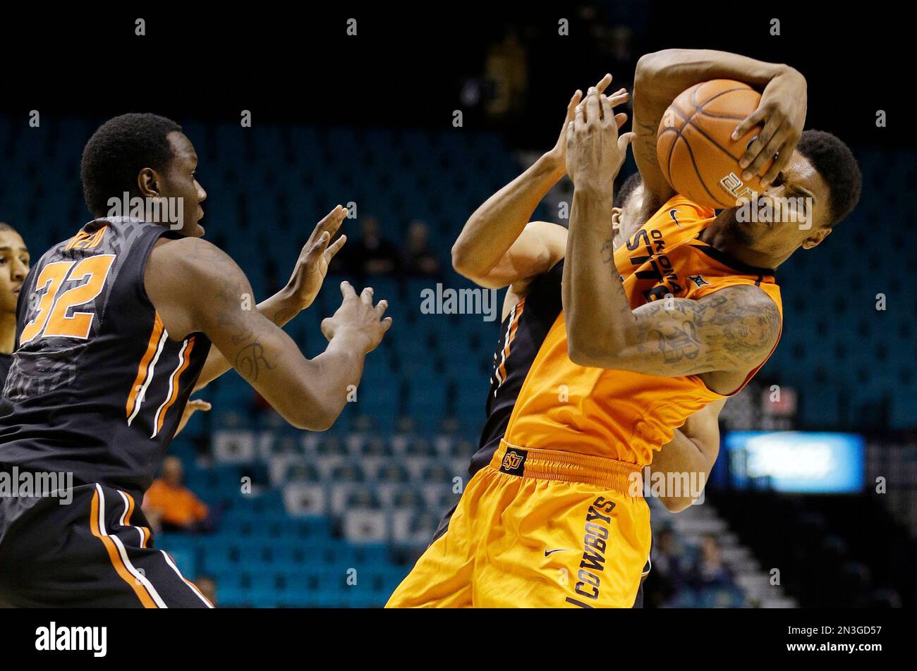 Oklahoma State player Le'Bryan Nash, right, keeps the the ball away ...